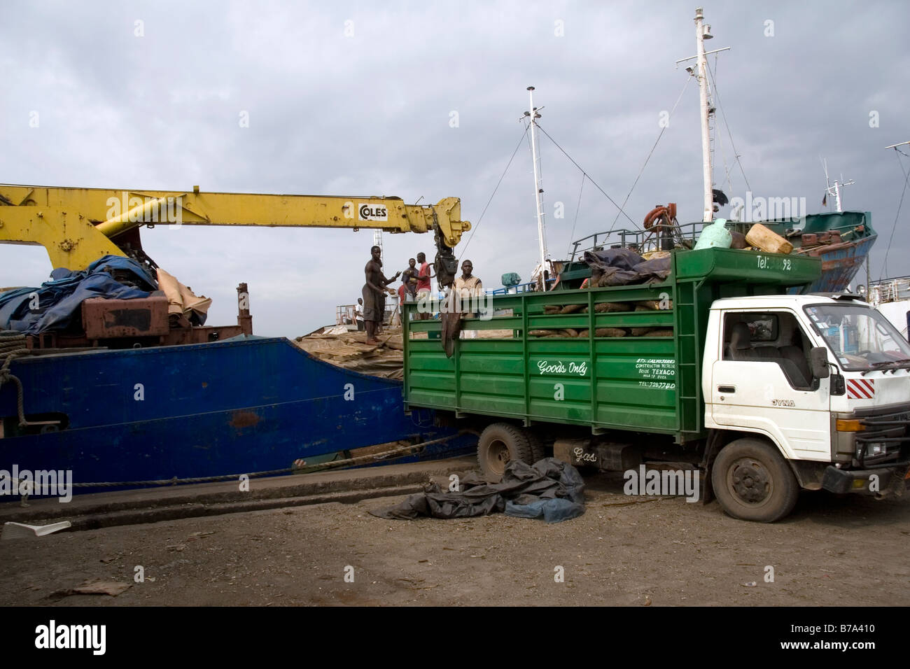 Dock workers at Douala Cameroon West Africa loading yams on to ship for ...