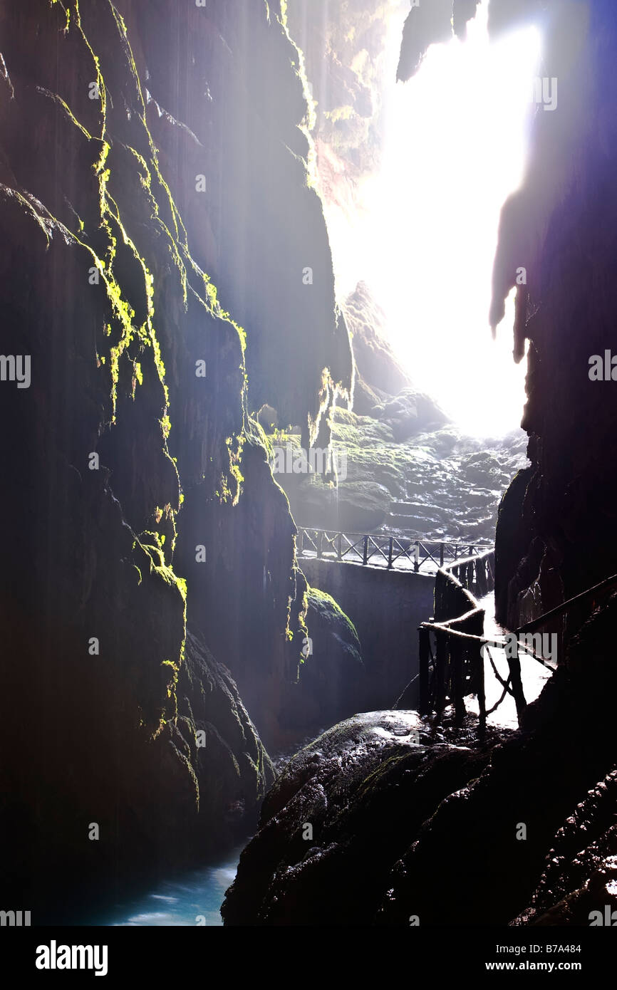 Cave behind waterfall Stock Photo - Alamy