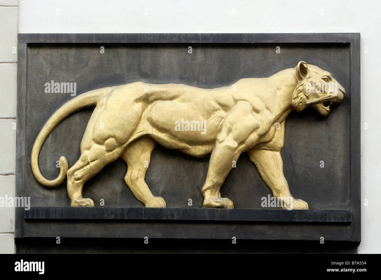 Relief of a golden tiger in a restaurant, Prague, Czech Republic ...