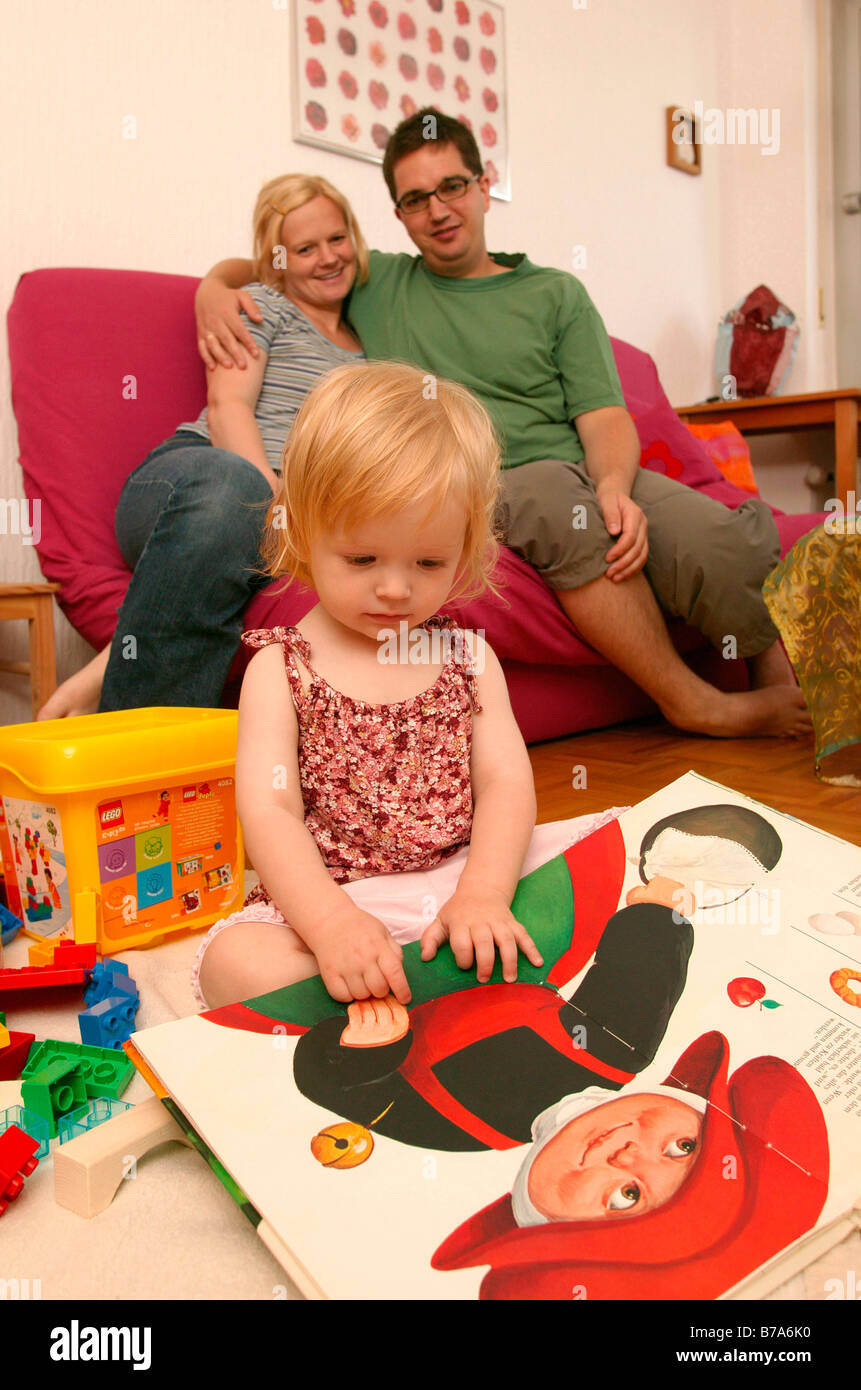 Proud parents looking at their child Stock Photo - Alamy