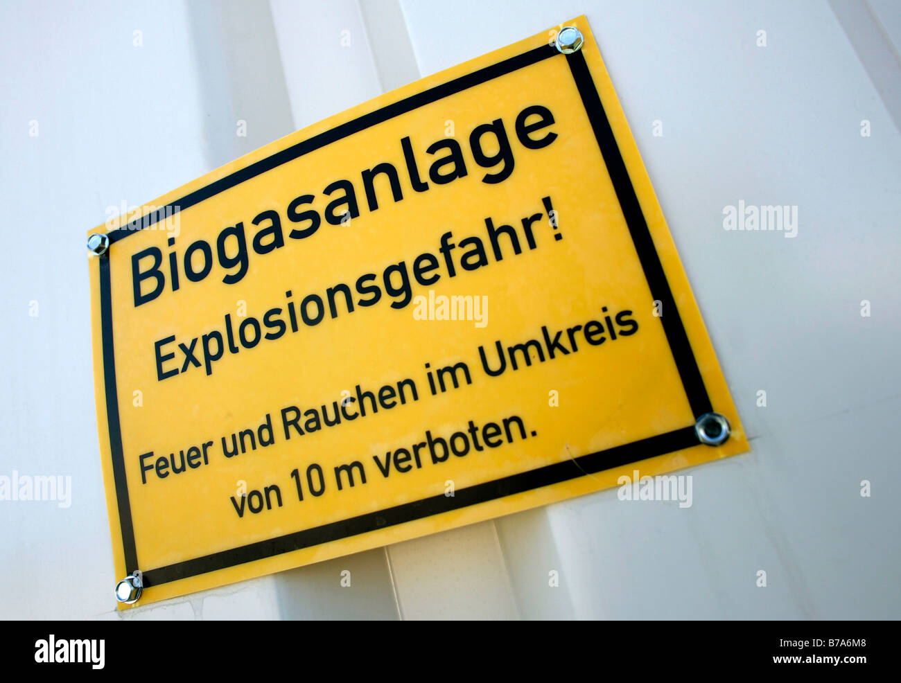 Warning sign, danger of explosion at the technical building of a biogas ...