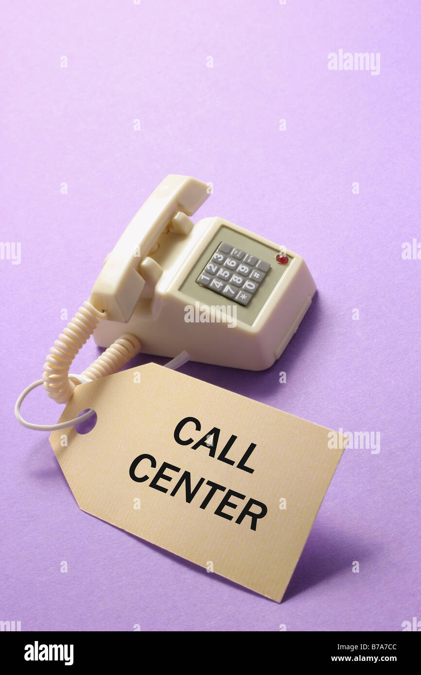 Miniature telephone and 'Call Center' tag Stock Photo - Alamy