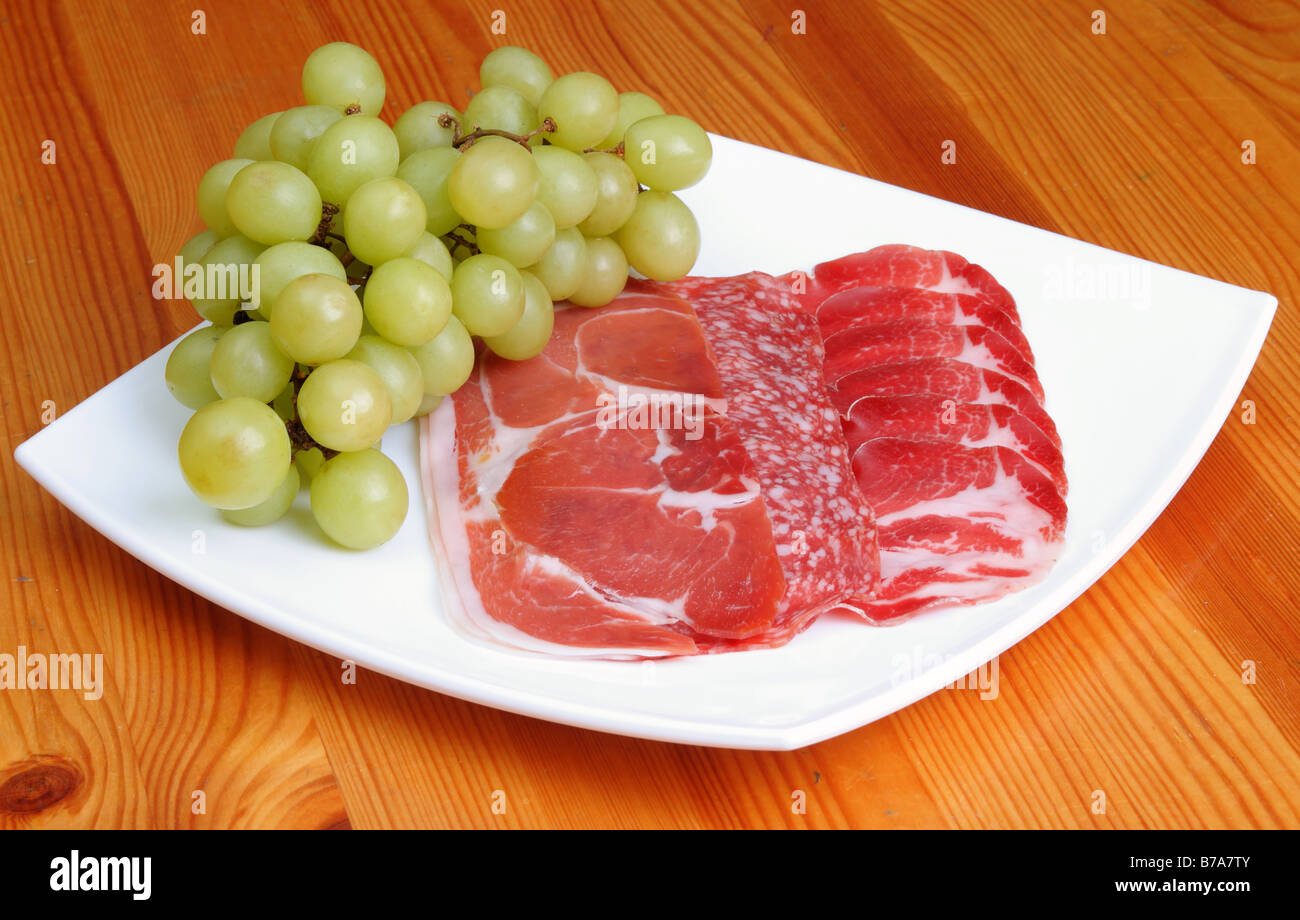 ham and salami slice with grape Stock Photo - Alamy