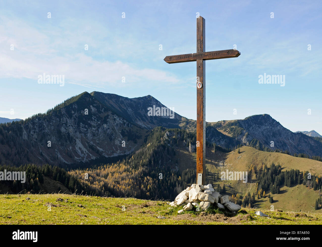 Cross on the summit of Bruennsteinschanze, 1545m with view to the ...