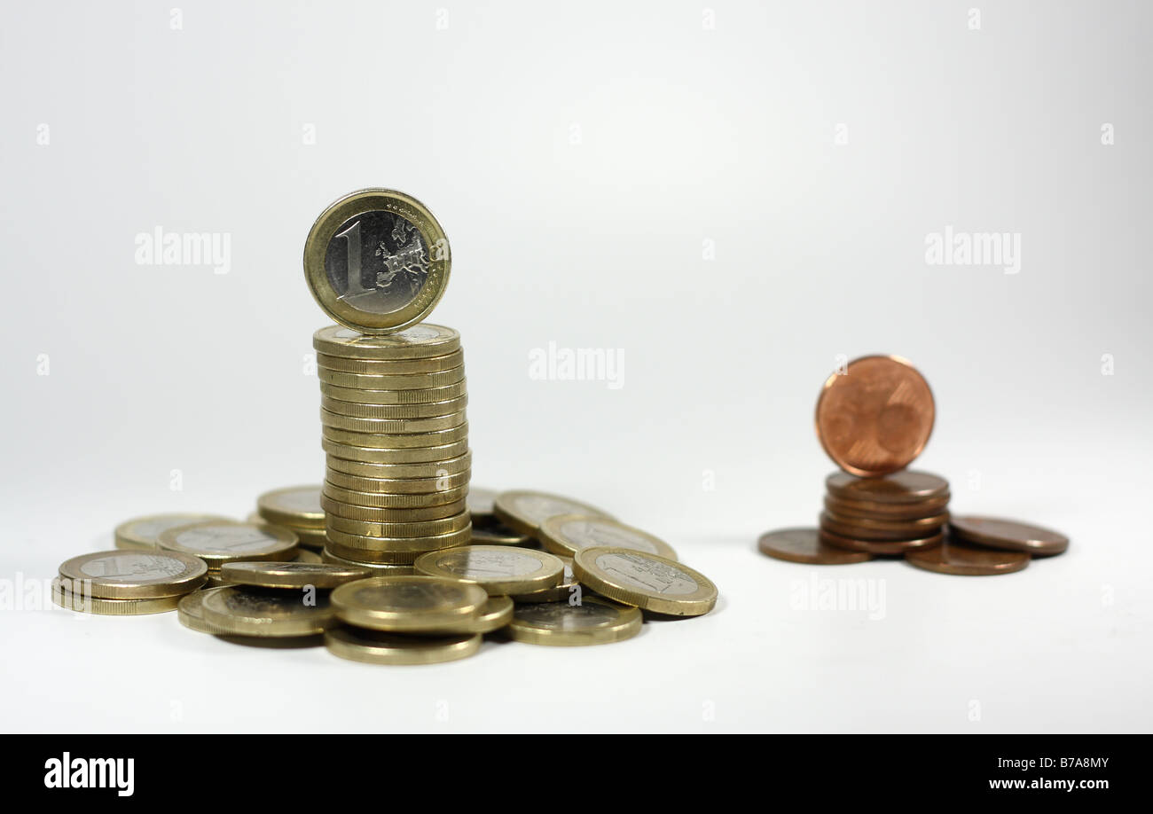 Two money towers with Euro coins Stock Photo - Alamy
