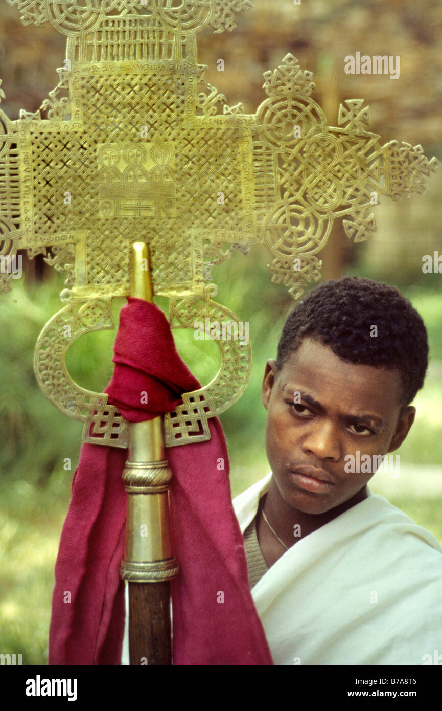 Deacon with processional cross Stock Photo - Alamy