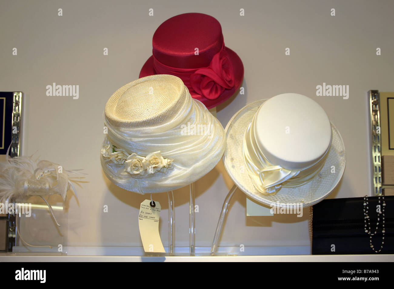 Hats on display at a formal ladies fashion ware store Stock Photo - Alamy
