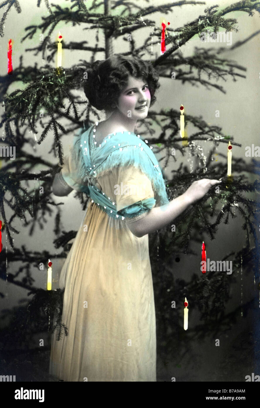 Historical photo, woman with Christmas tree, ca. 1910 Stock Photo - Alamy