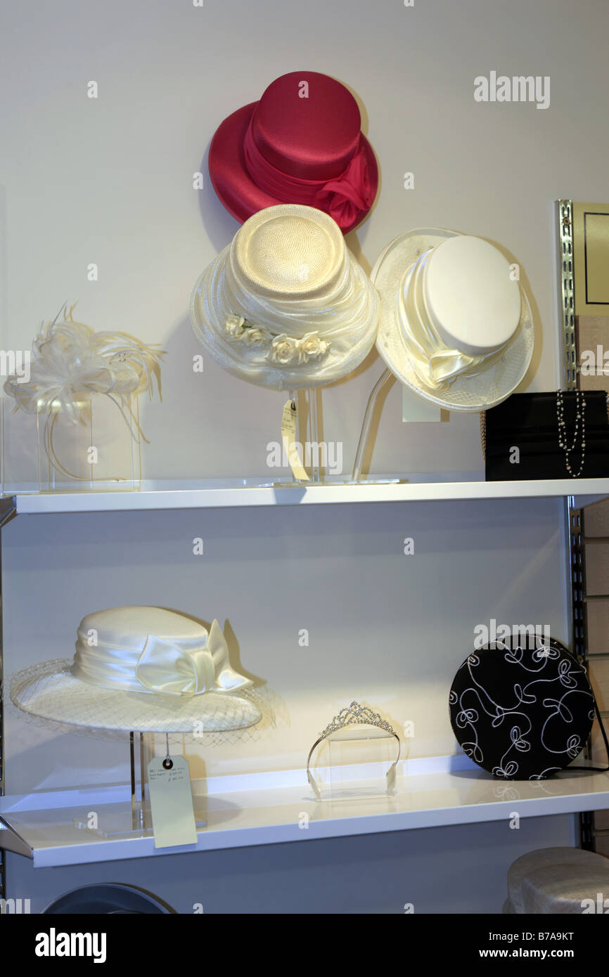 Hats on display at a formal ladies fashion ware store Stock Photo - Alamy