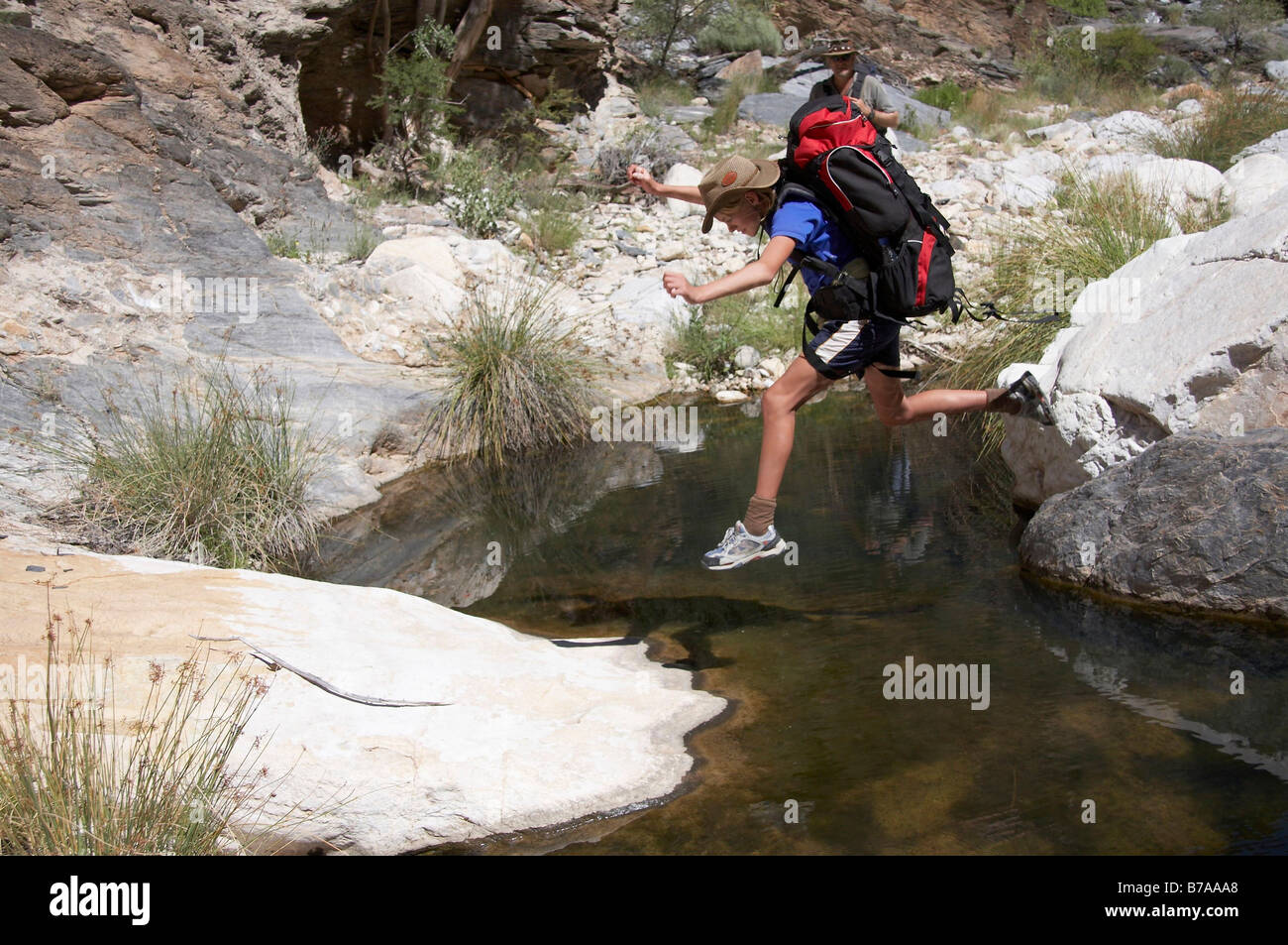 Jumping over a stream of water hi-res stock photography and images - Alamy