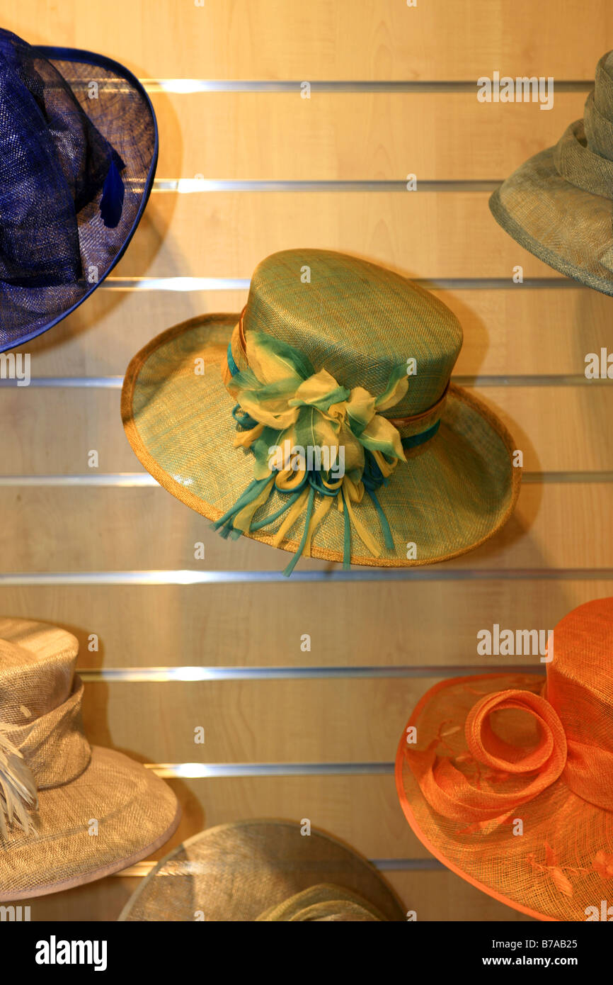 Hats on display at a formal ladies fashion ware store Stock Photo - Alamy