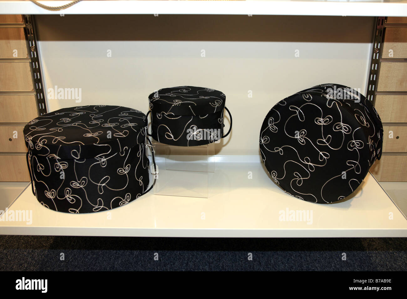 Hats on display at a formal ladies fashion ware store Stock Photo - Alamy