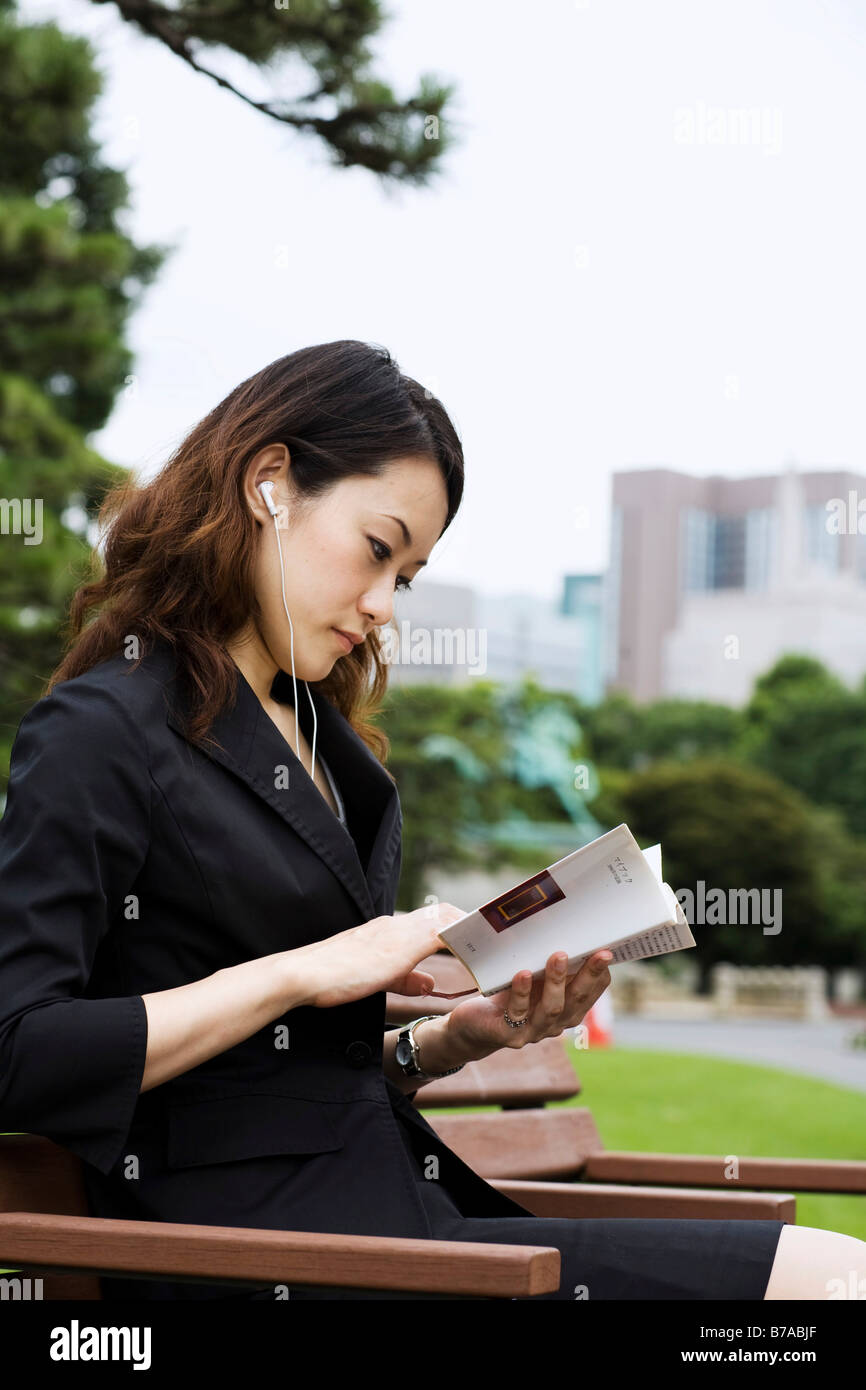 Young Asian woman reading a book in the park, Tokyo, Japan, Asia Stock ...