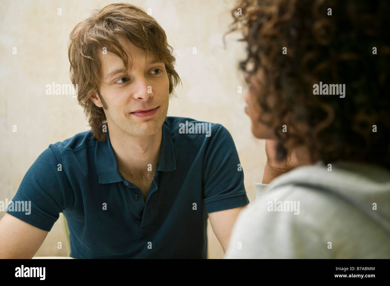 Young couple talking, Germany Stock Photo - Alamy