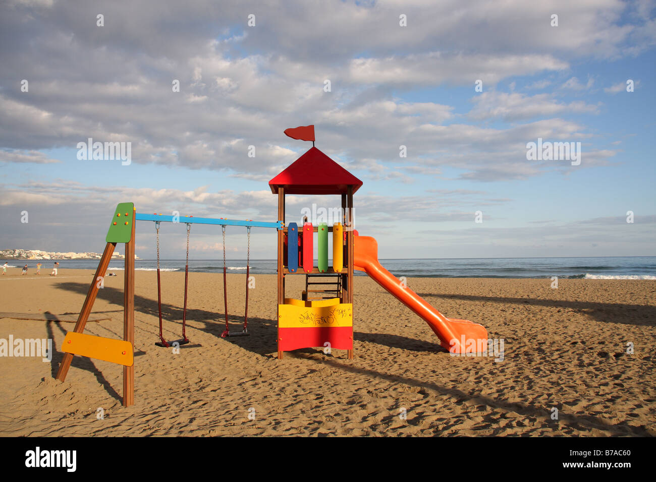 A colourful playground on the beach Stock Photo - Alamy