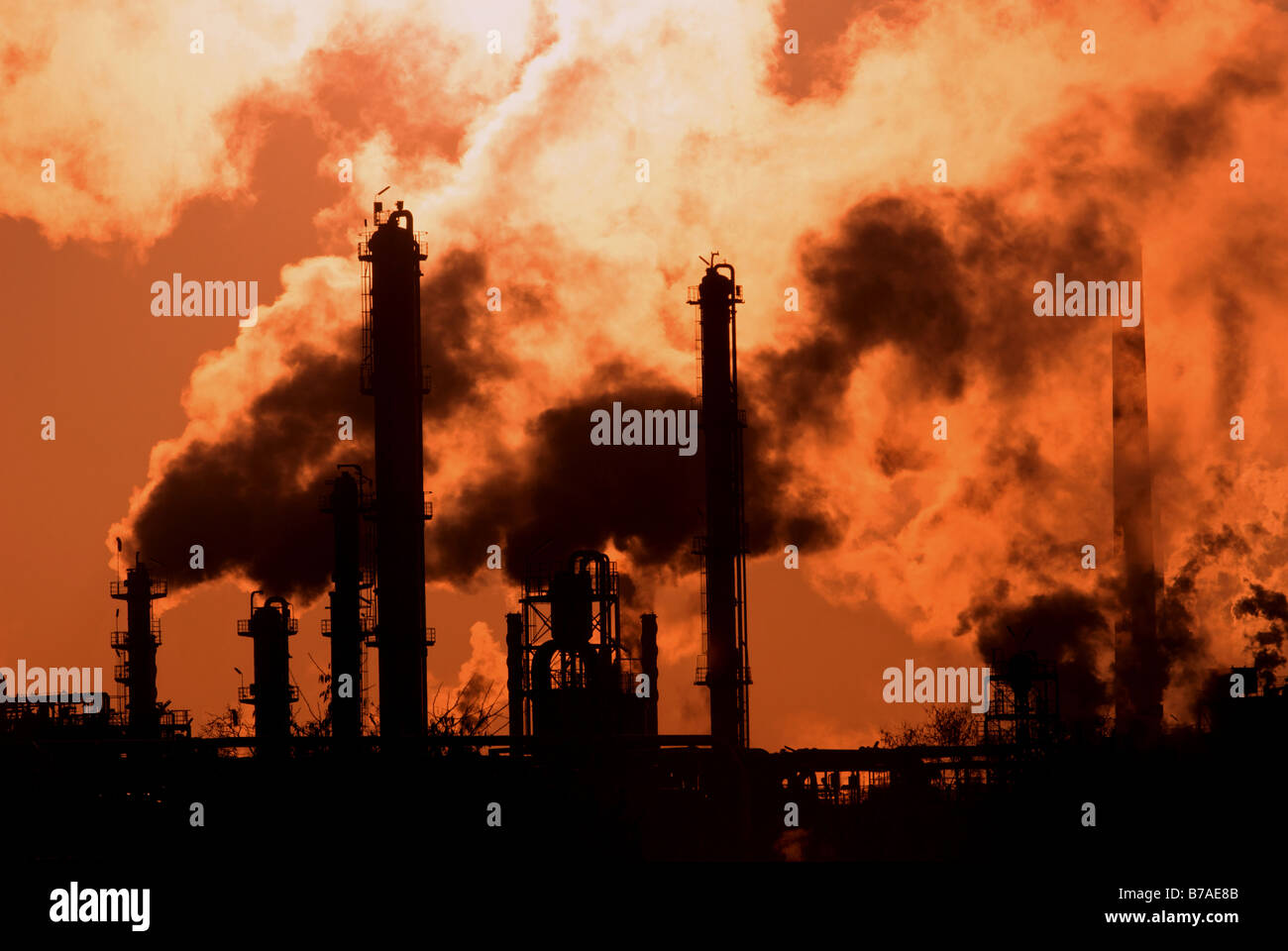 Sun setting behind chemical factory, Germany Stock Photo - Alamy