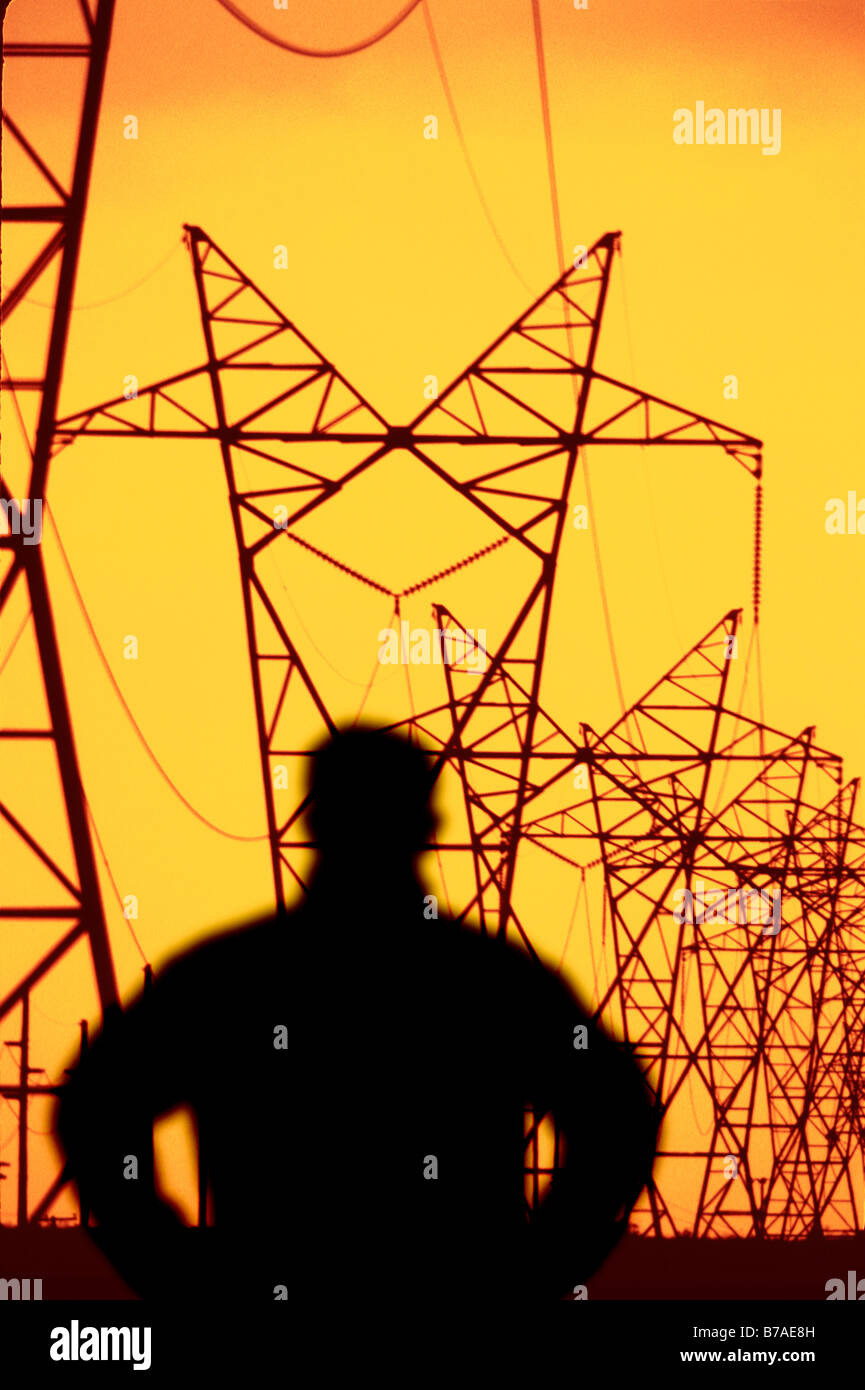 engineer checking electric power lines at sunset Stock Photo - Alamy