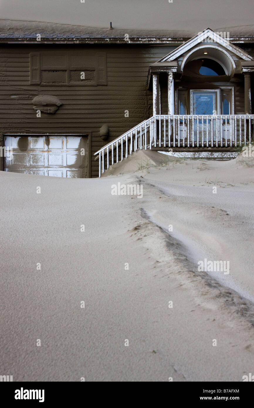 House and driveway covered in sand after a large storm on the Oregon ...