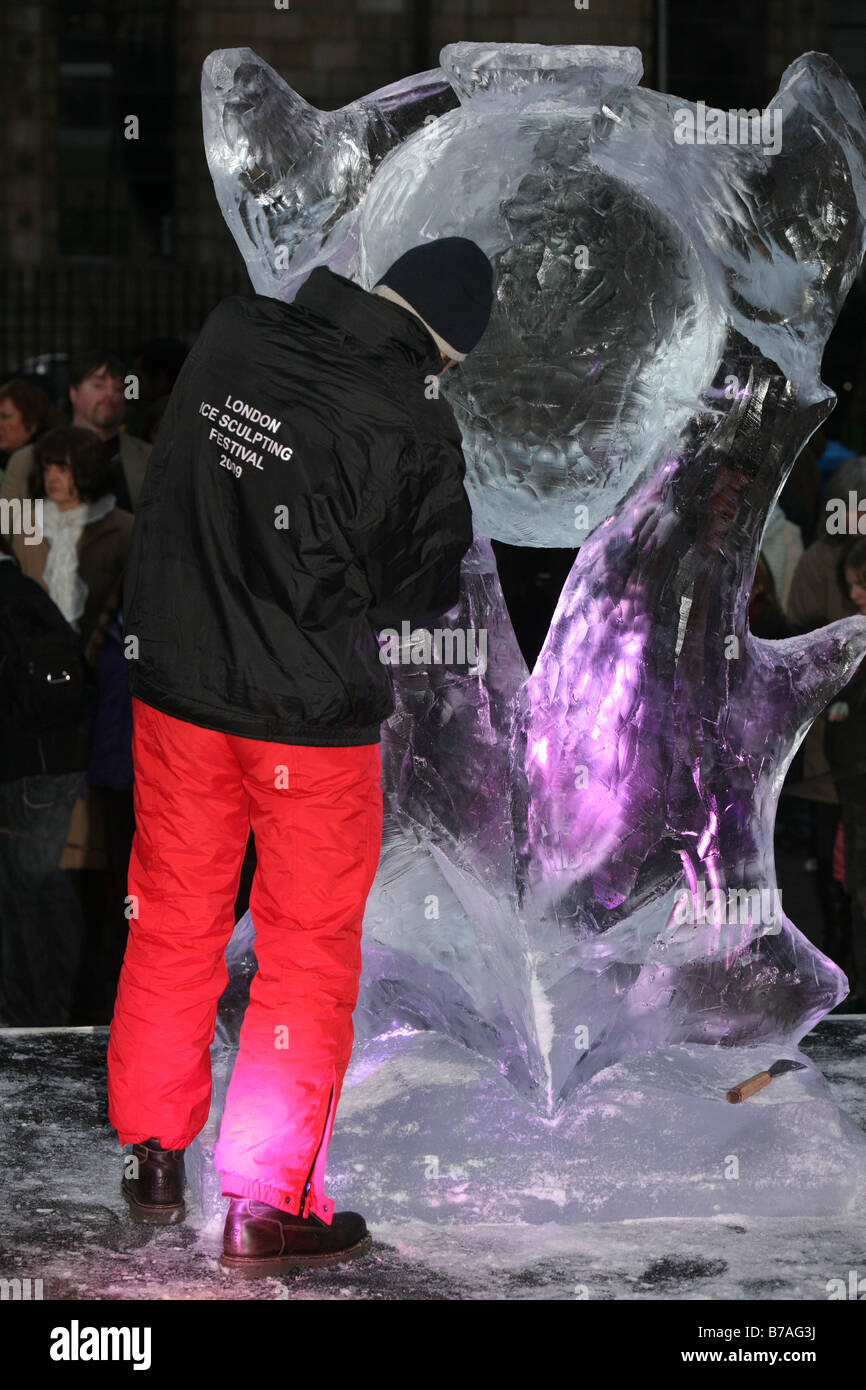 an ice sculpture sculpturing in central london during the international ...