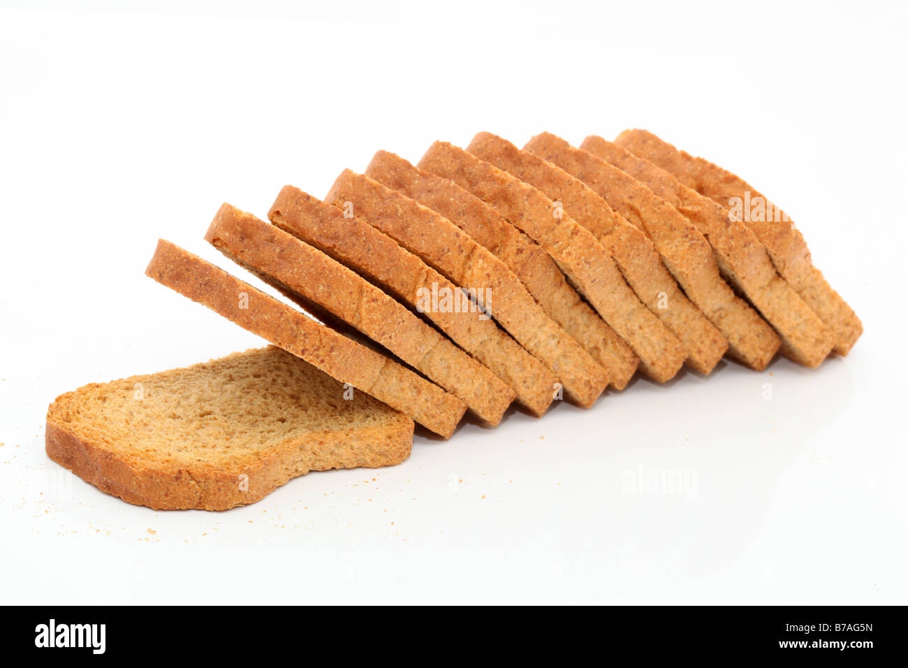 dry toasted bread loaf in slices isolated on white background Stock ...