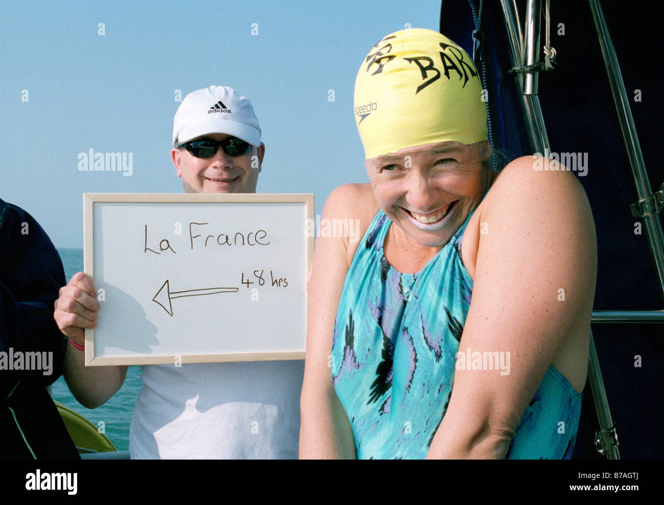 Charity cross channel swim with a funny sign that France is 48 hours ...