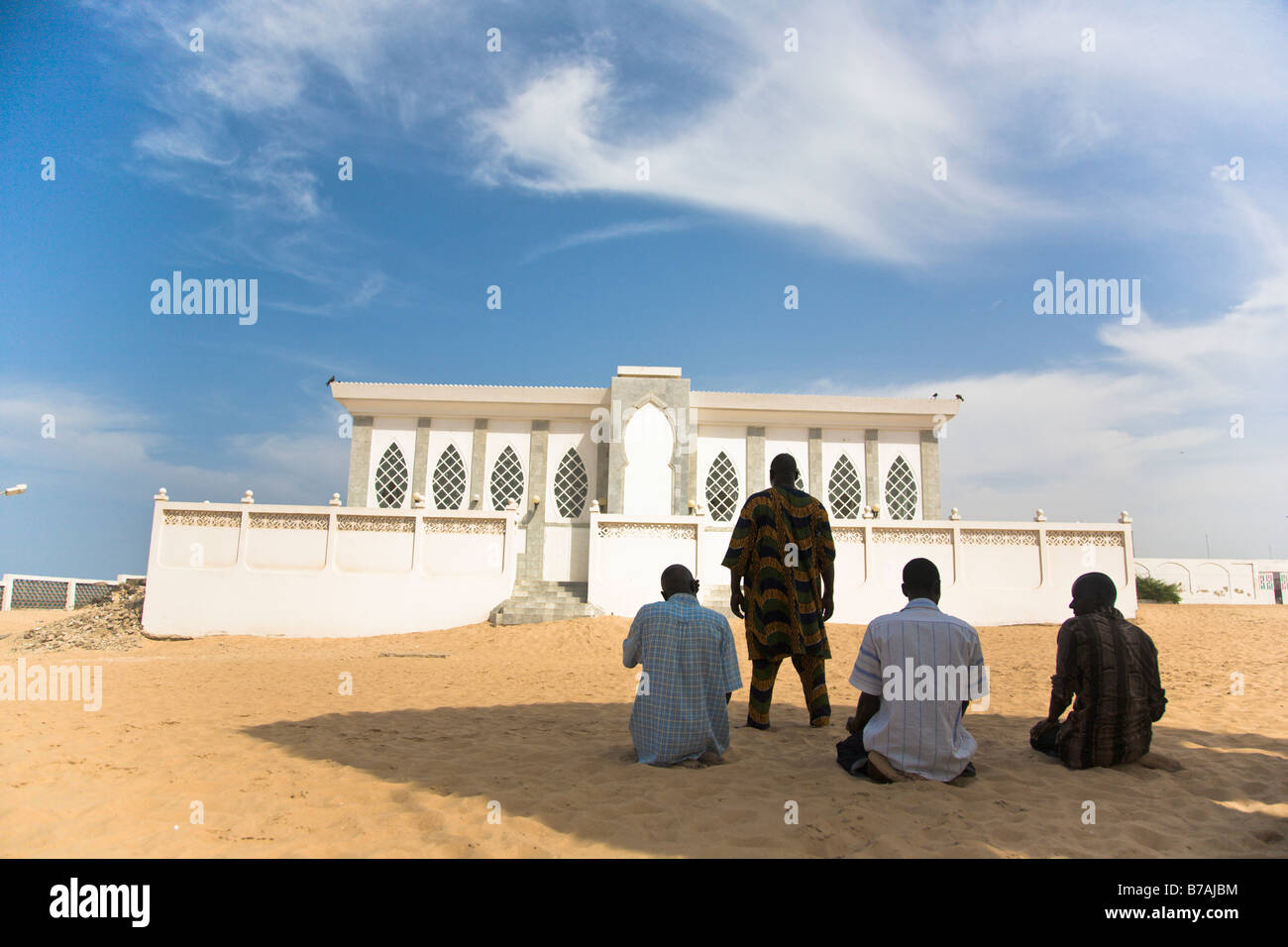 Muslim men pray at the Seydina Limamou Laye Mausoleum, which sits on ...
