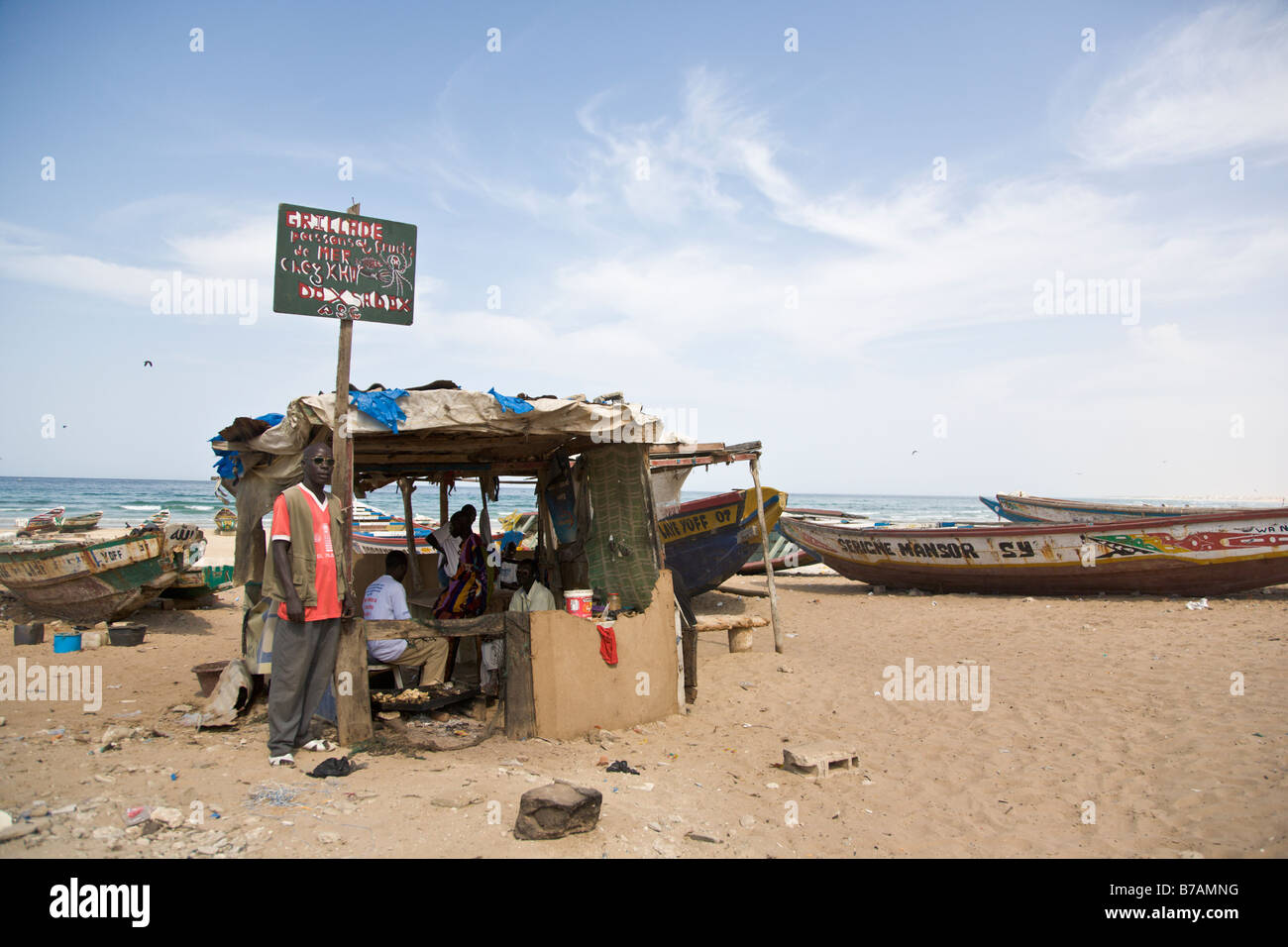 A beachside "restaurant" serves fresh grilled fish in Yoff, a fishing ...