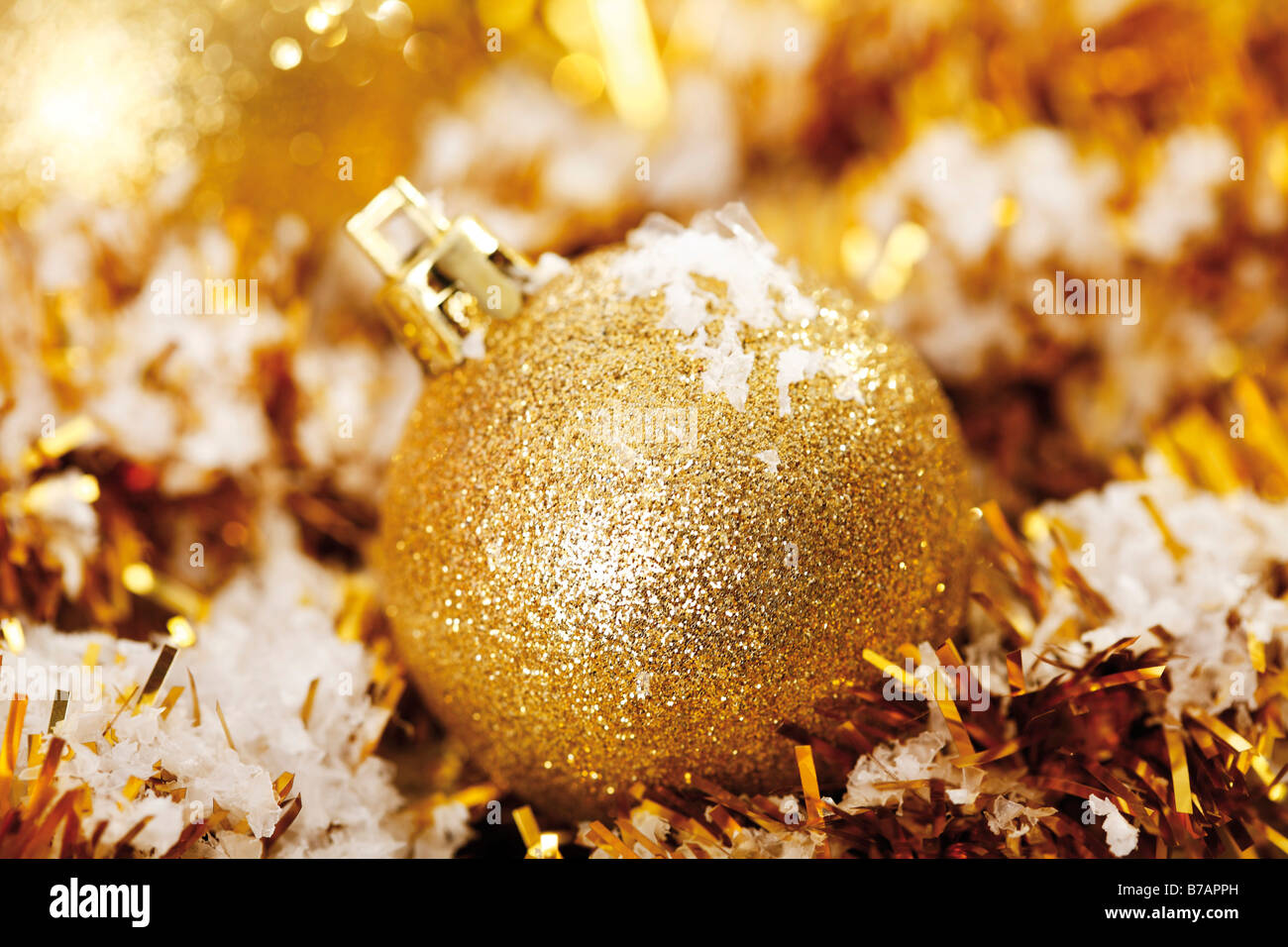 Gold glitter Christmas tree ball with Christmas decorations Stock Photo ...