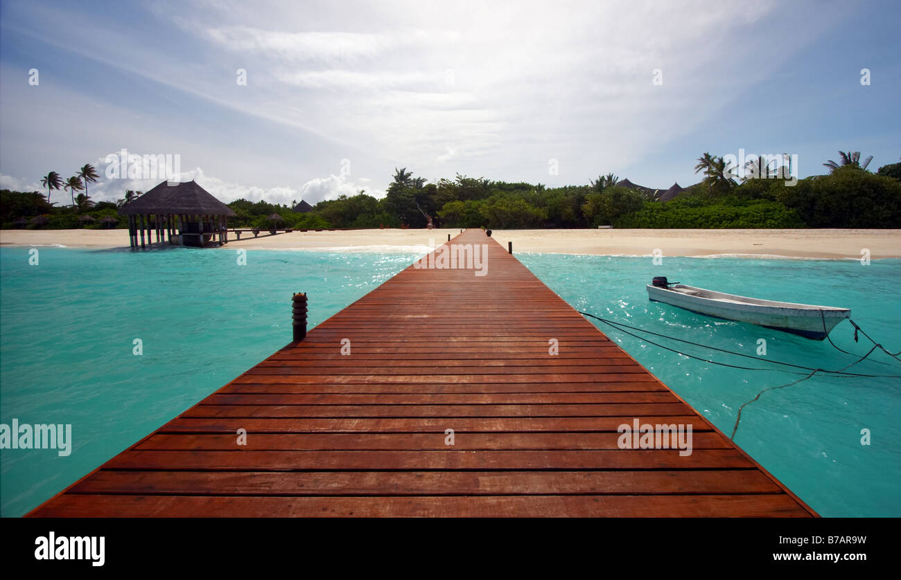 Wooden pathway leading to beautiful tropical island Stock Photo - Alamy