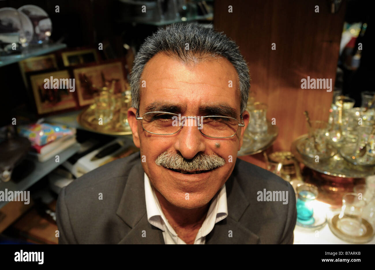 A smart Turkish shop-keeper, sitting in his small shop in the Grand ...