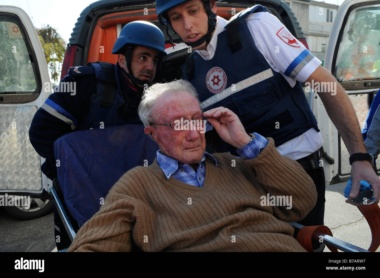 Paramedics of Magen David Adom emergency service evacuate an elderly ...