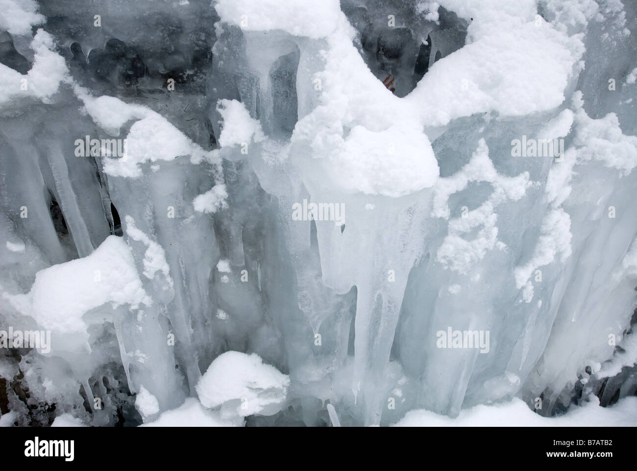 snow on icicles in winter Stock Photo - Alamy
