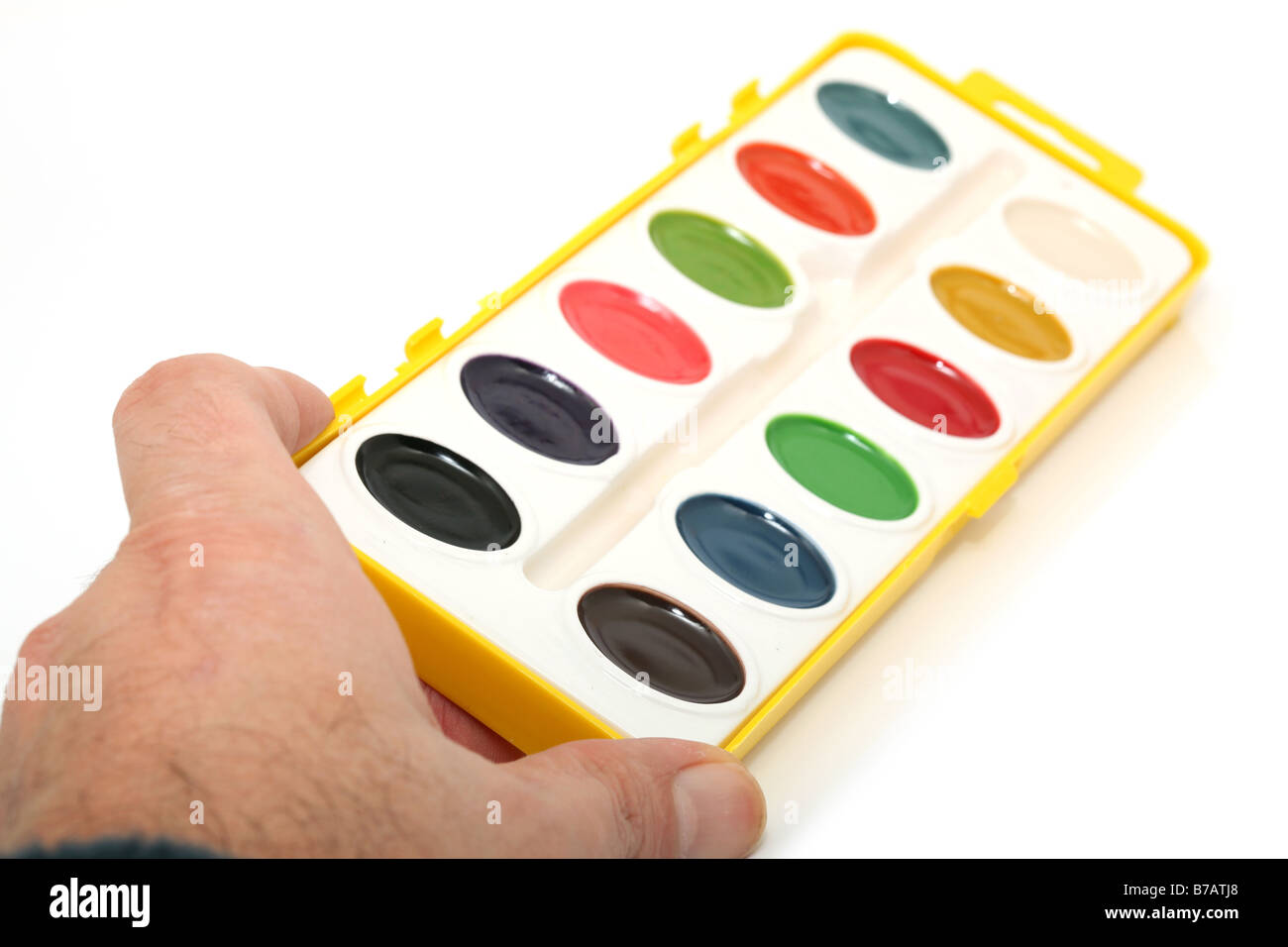 hand holding a water color palette isolated on white background Stock ...