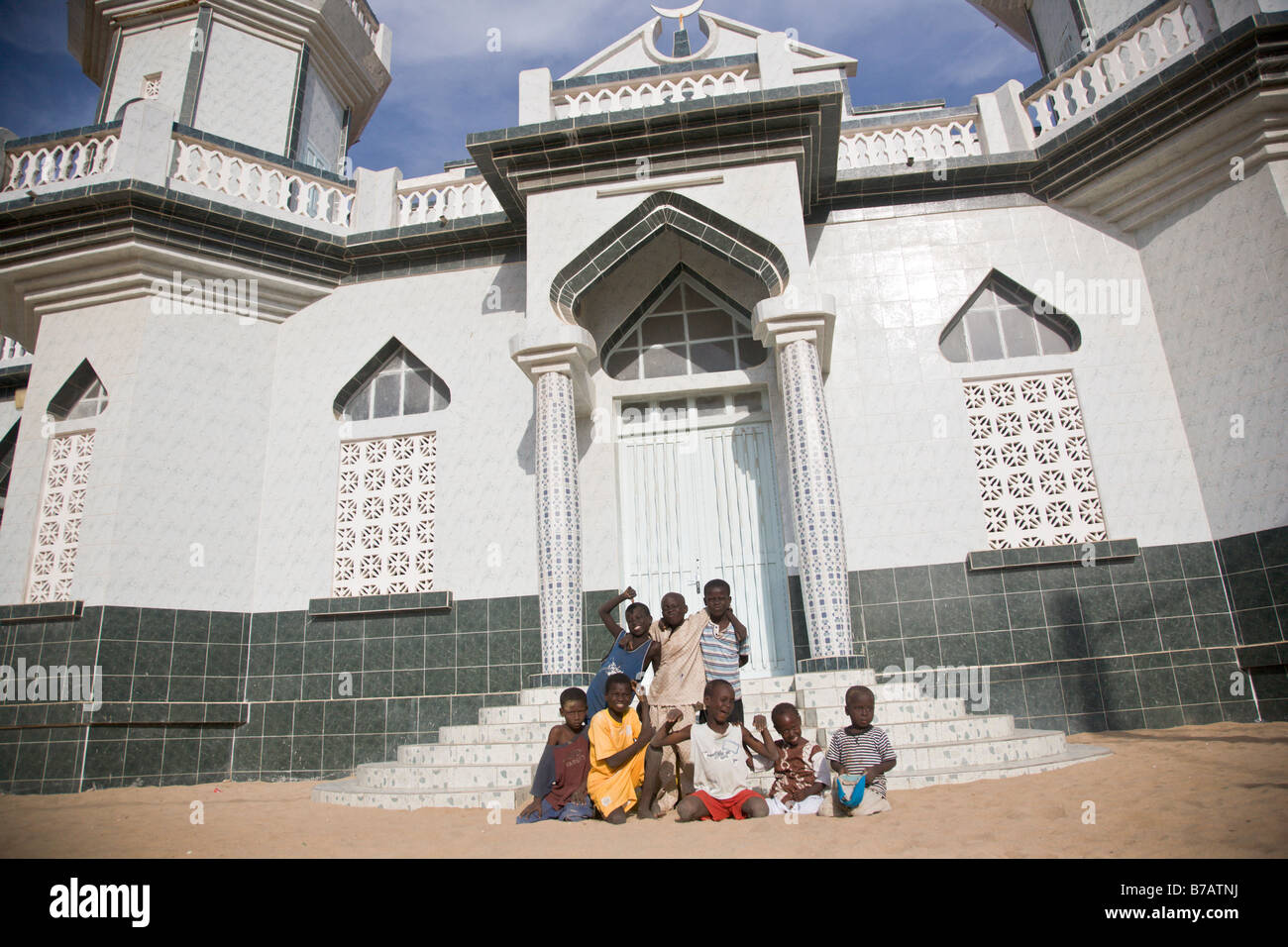 Children in Yoff, Senegal pose in front of a roadside mosque in this ...