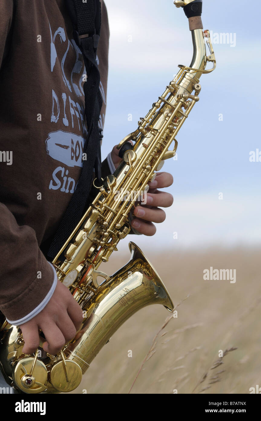 Children playing saxophone hi-res stock photography and images - Alamy