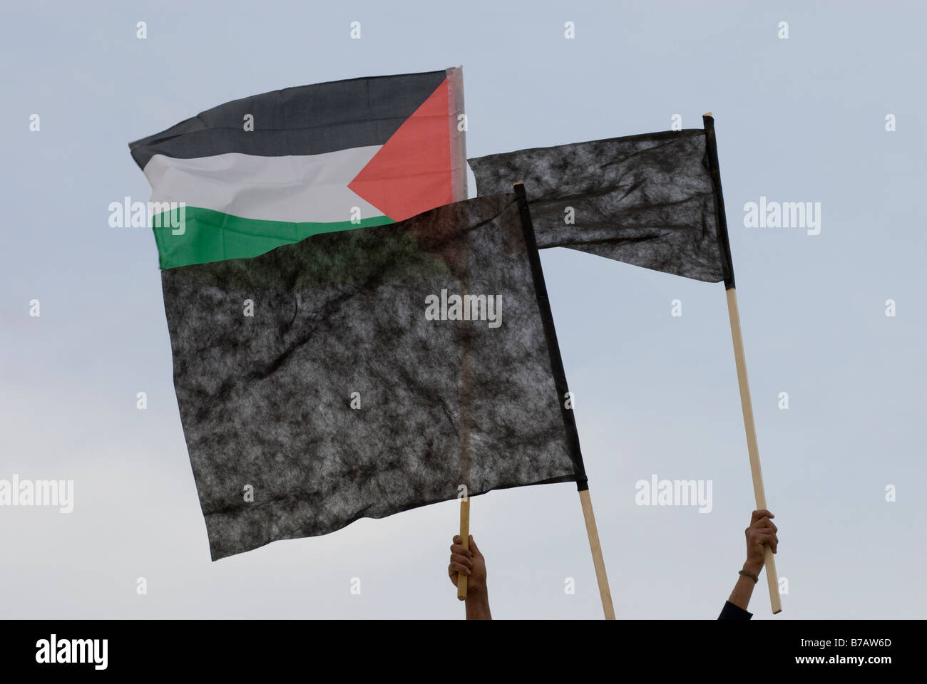 Protestors wave Palestinian and black flags during a protest against ...