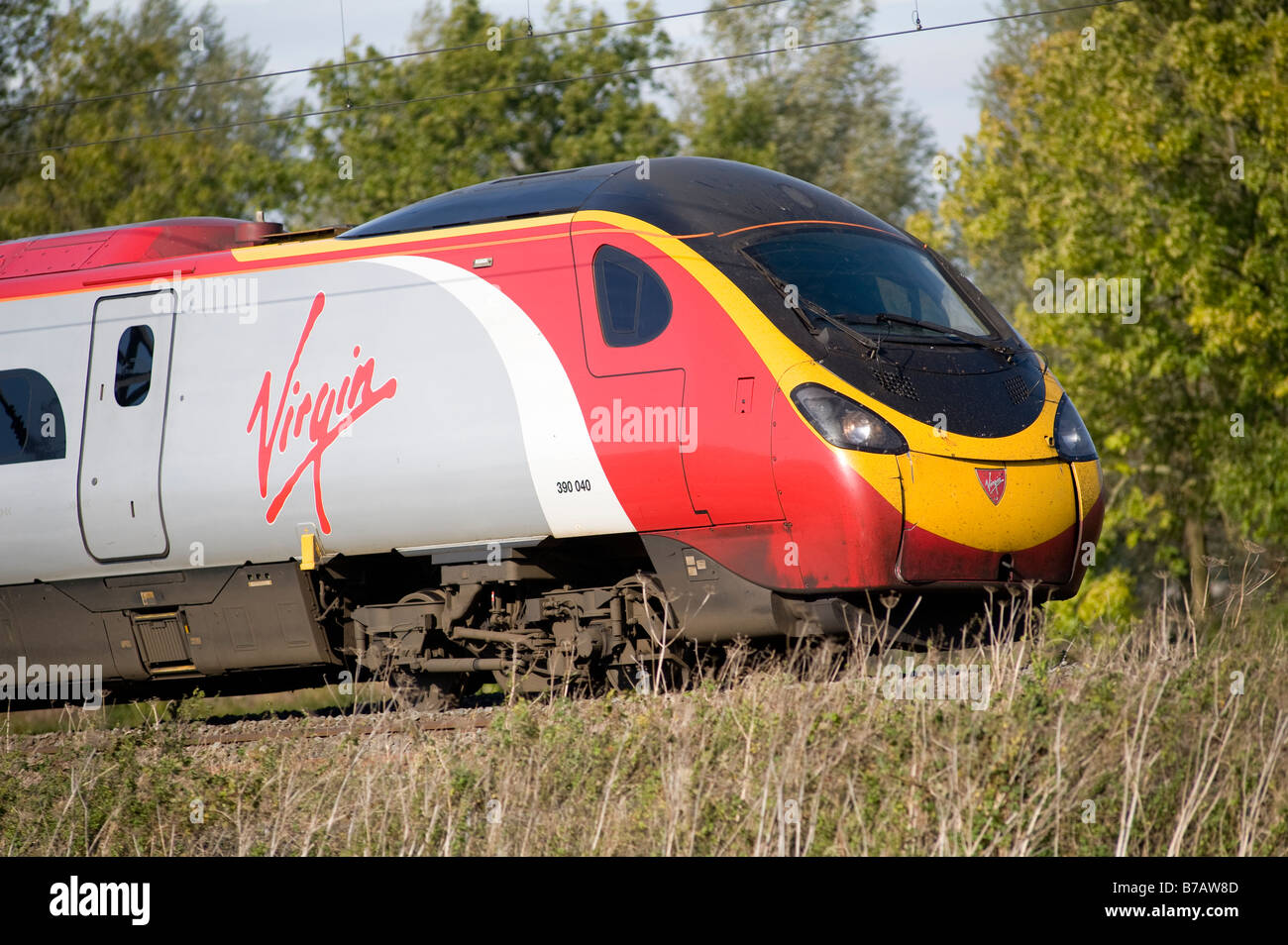 Virgin Class 390 Pendolino train travelling at speed through the ...
