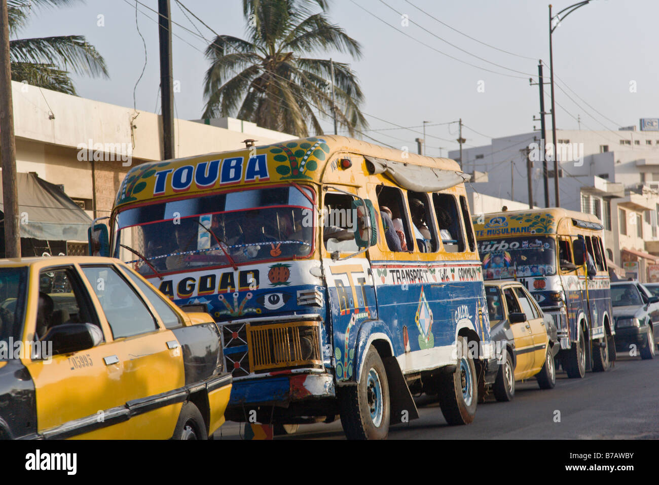 Colorfully painted buses roam the streets of Dakar, Senegal Stock Photo ...