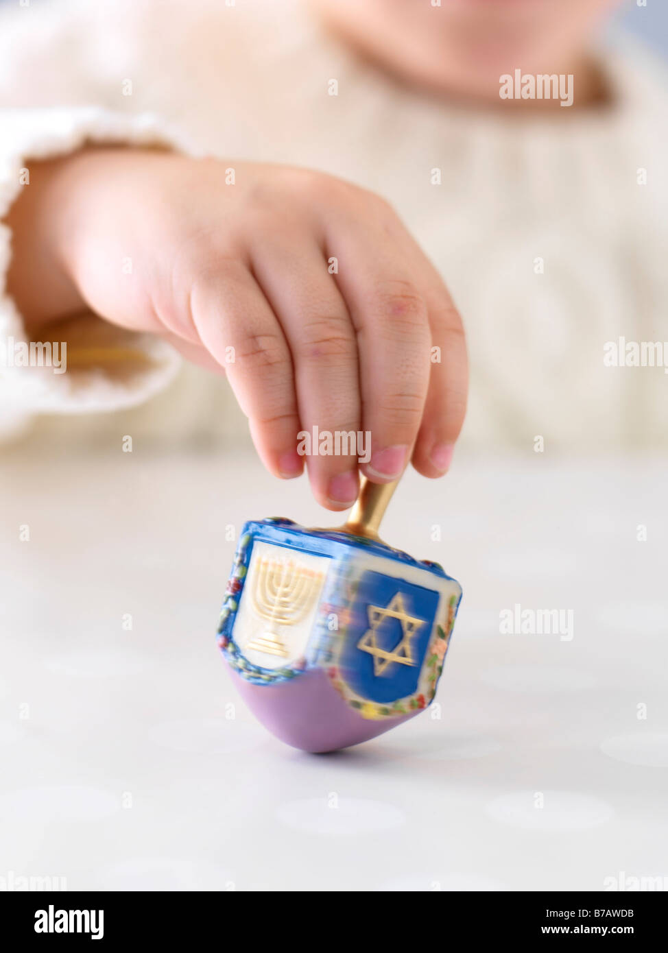 Boy Spinning Dreidel Stock Photo - Alamy