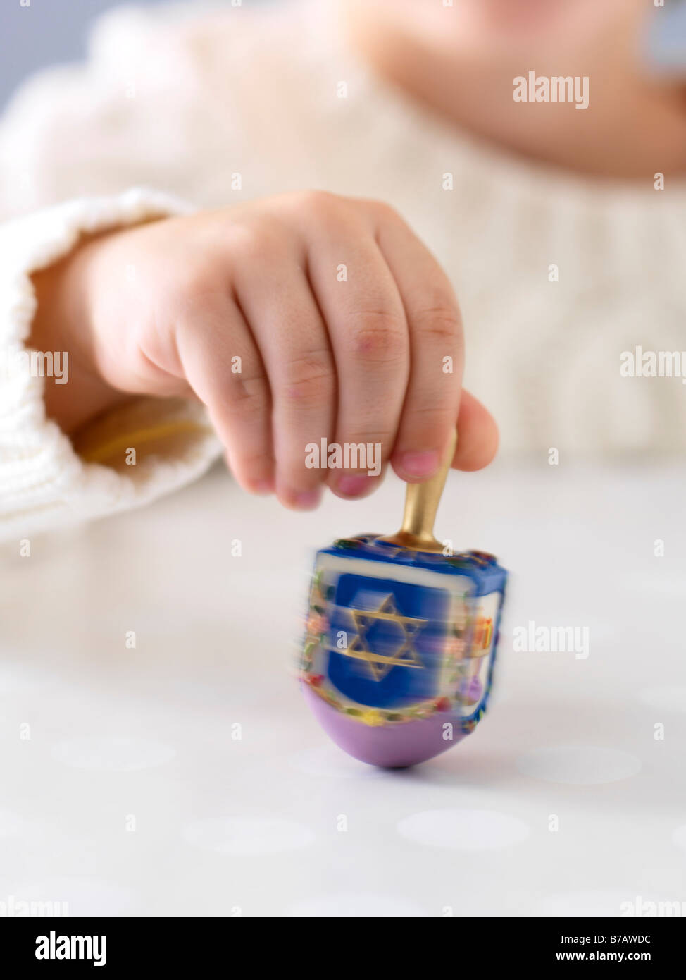 Boy Spinning Dreidel Stock Photo - Alamy