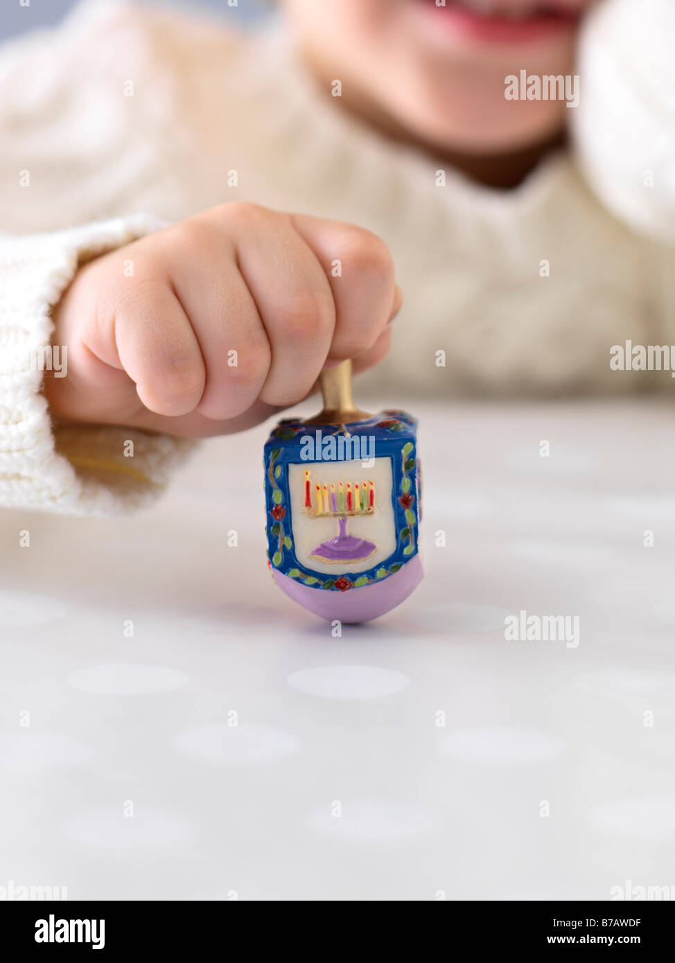 Boy Spinning Dreidel Stock Photo - Alamy