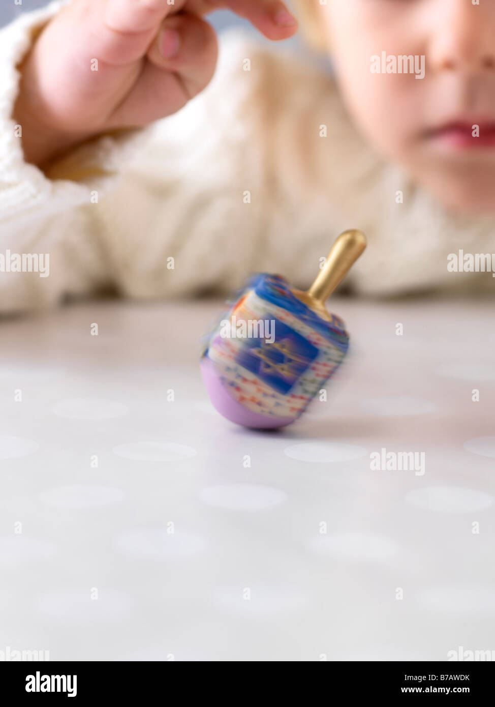 Boy Spinning Dreidel Stock Photo - Alamy