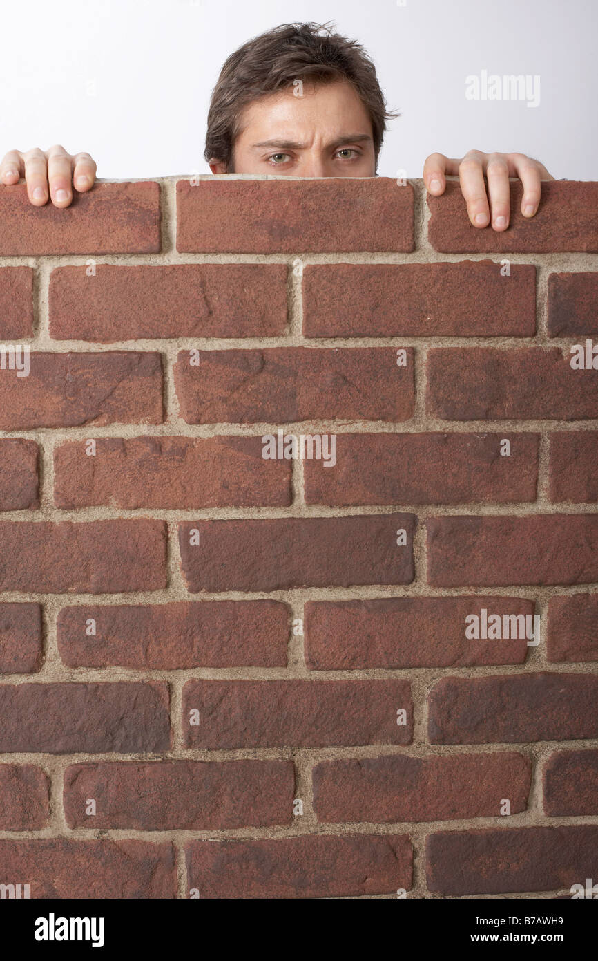 Man Peeking Over Wall High Resolution Stock Photography and Images - Alamy