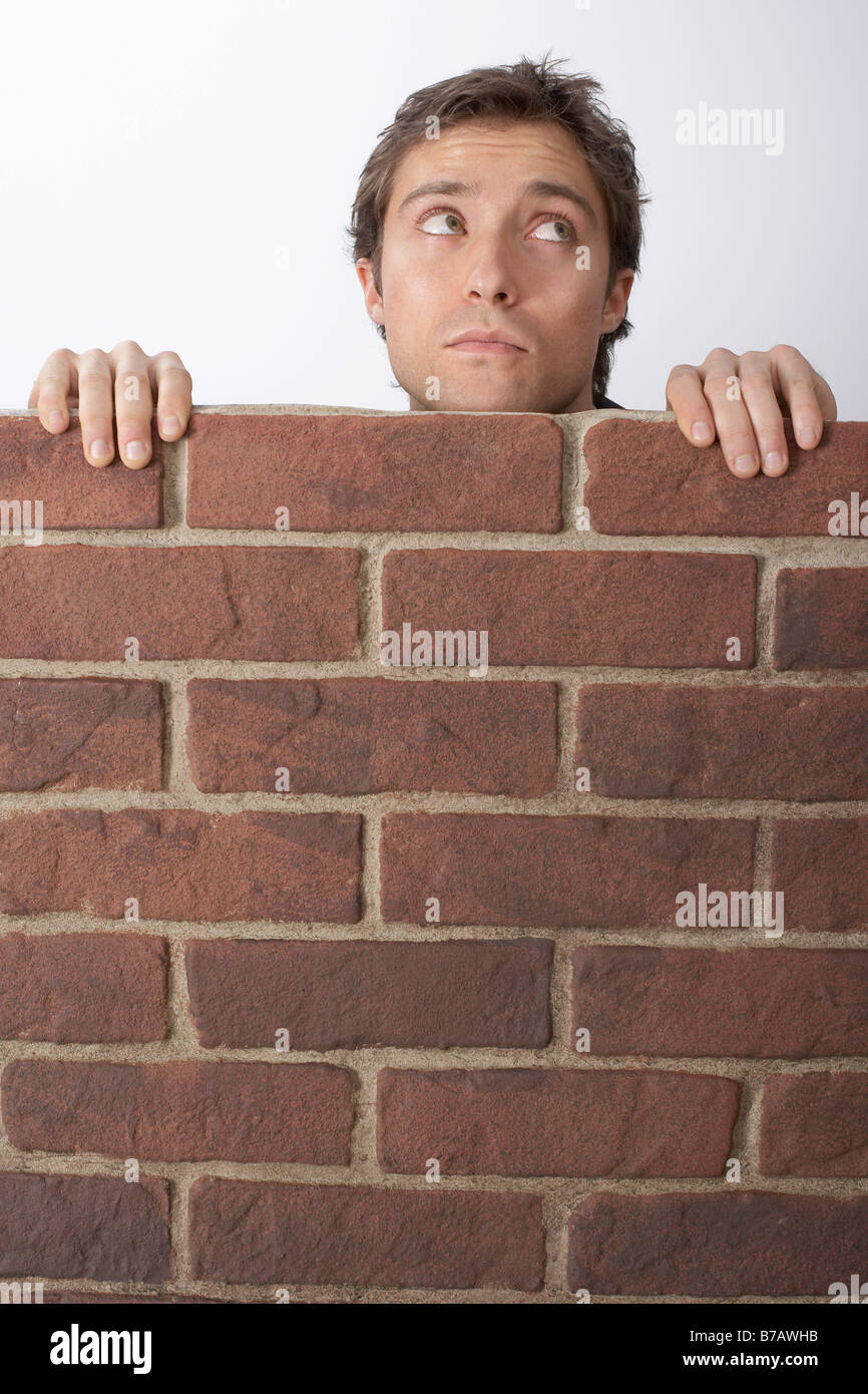 Man Peeking Over Wall High Resolution Stock Photography and Images - Alamy