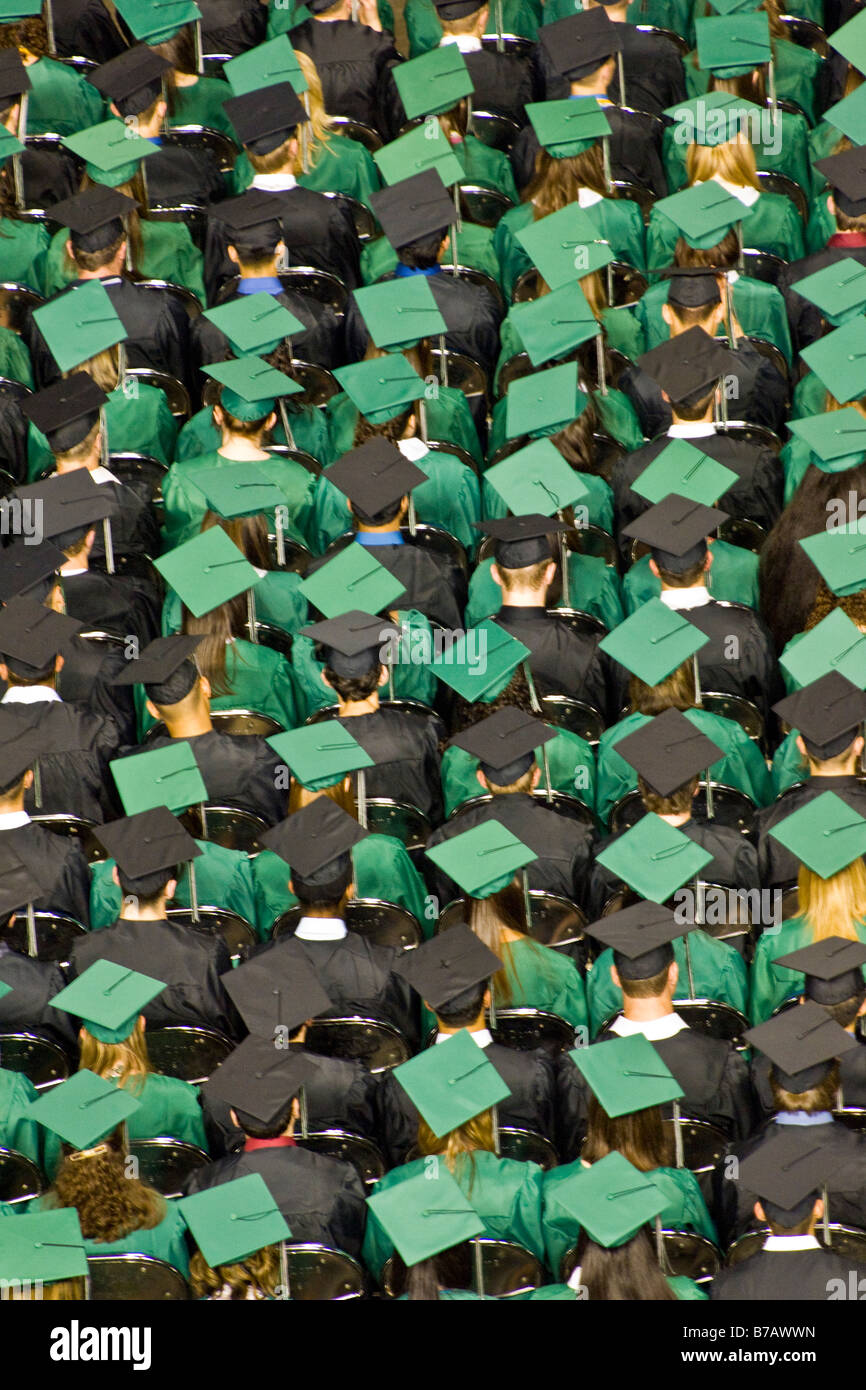 Green Graduation Caps In The Air