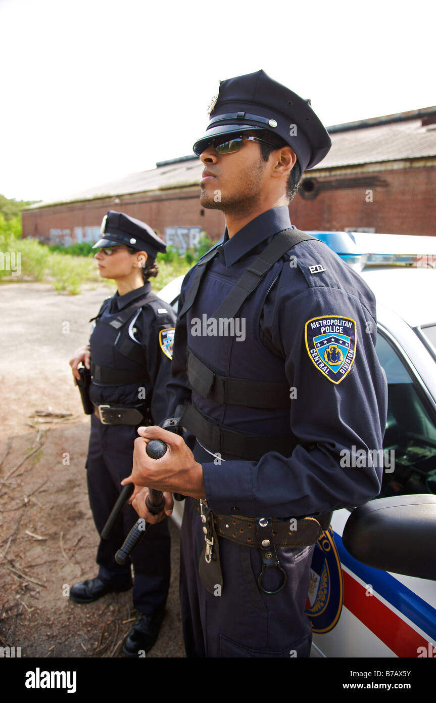 Police Officers Standing by Police Car Stock Photo - Alamy