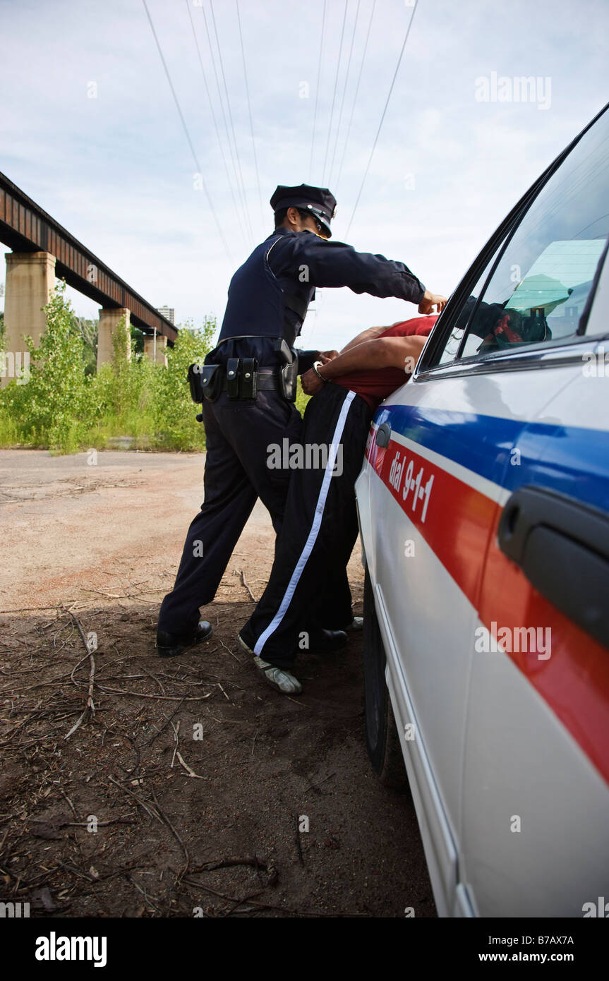 Police Officer Arresting Suspect Stock Photo - Alamy