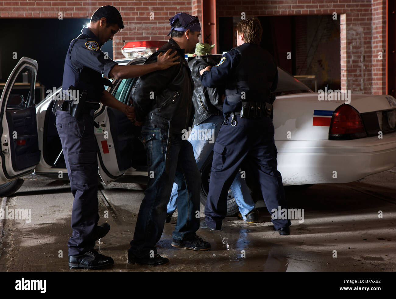 Police Officers Arresting Suspects Stock Photo - Alamy
