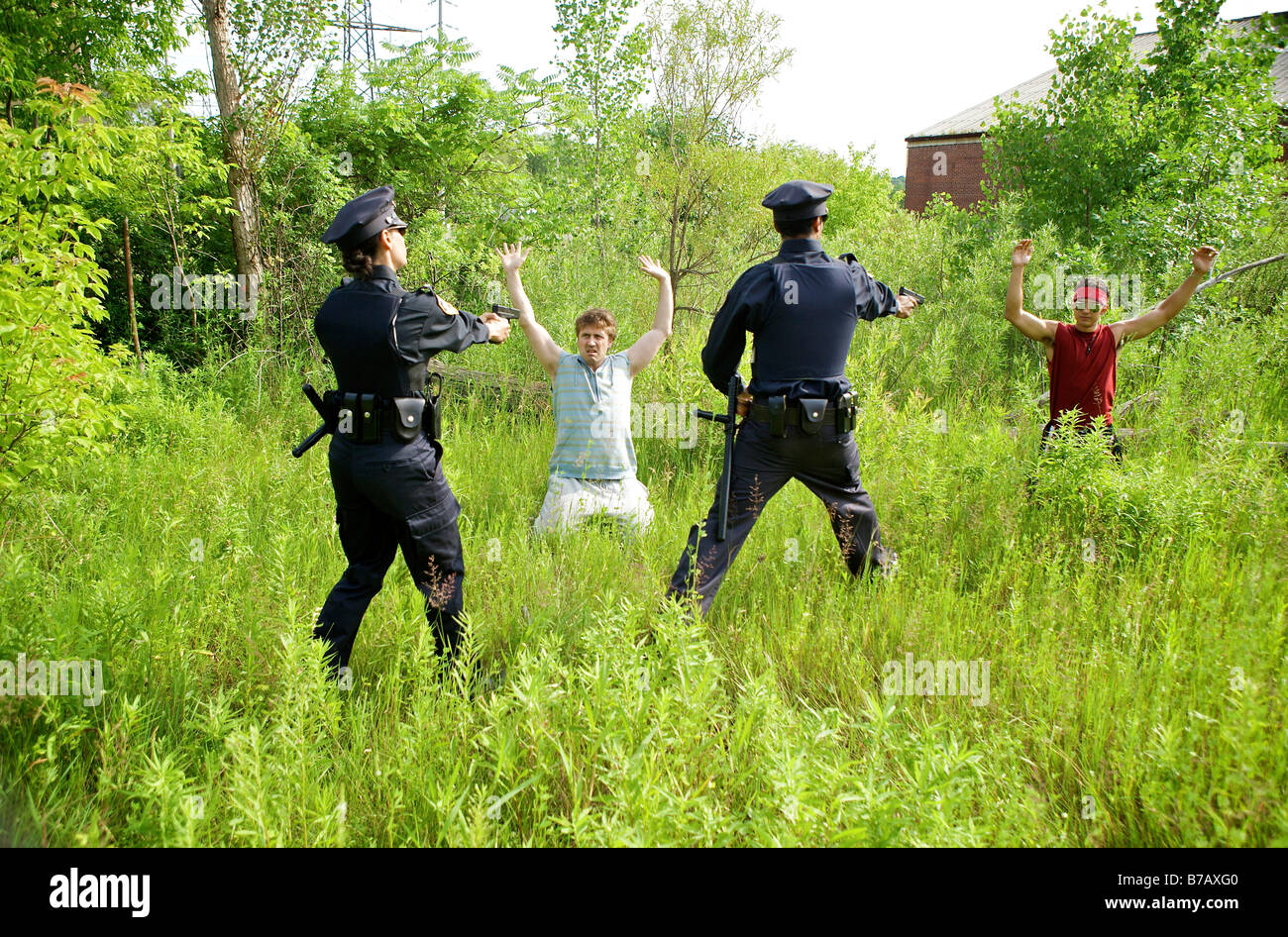 Police Officers Arresting Suspects Stock Photo - Alamy