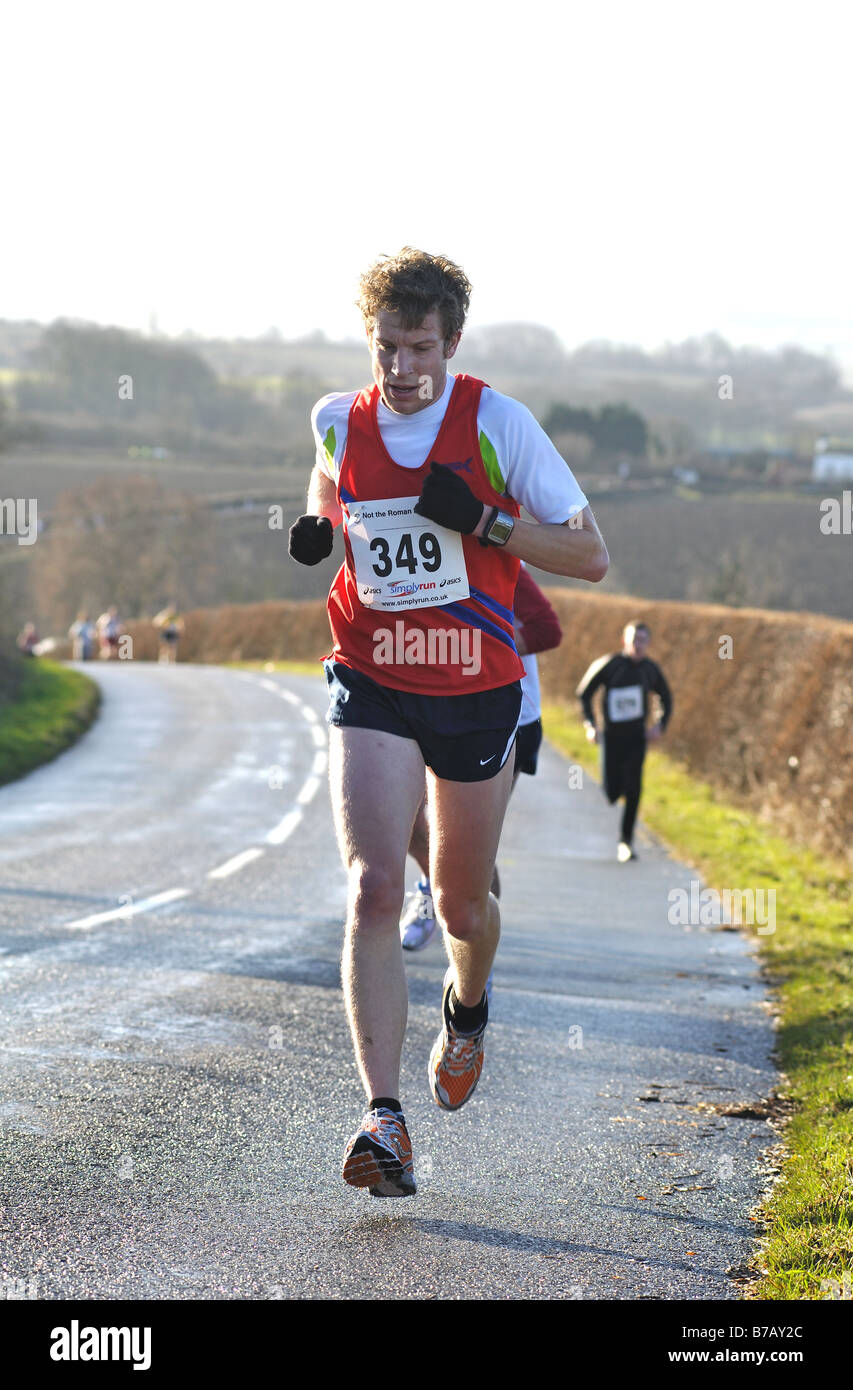 Runner with both feet off ground hi-res stock photography and images ...